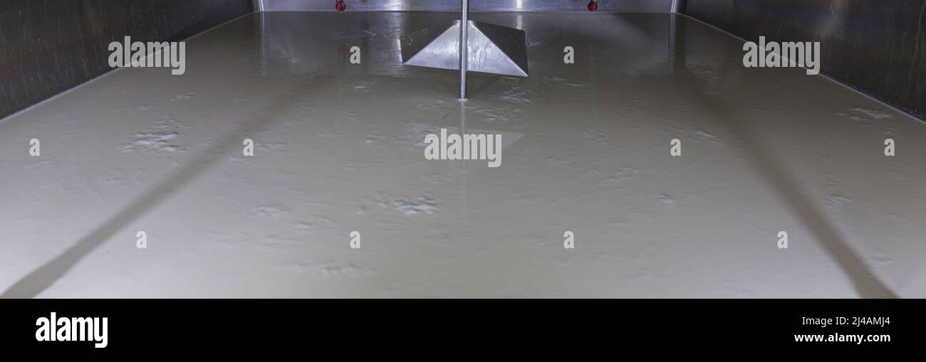 Bulk stainless steel refrigerated milk tank on a English dairy farm ...
