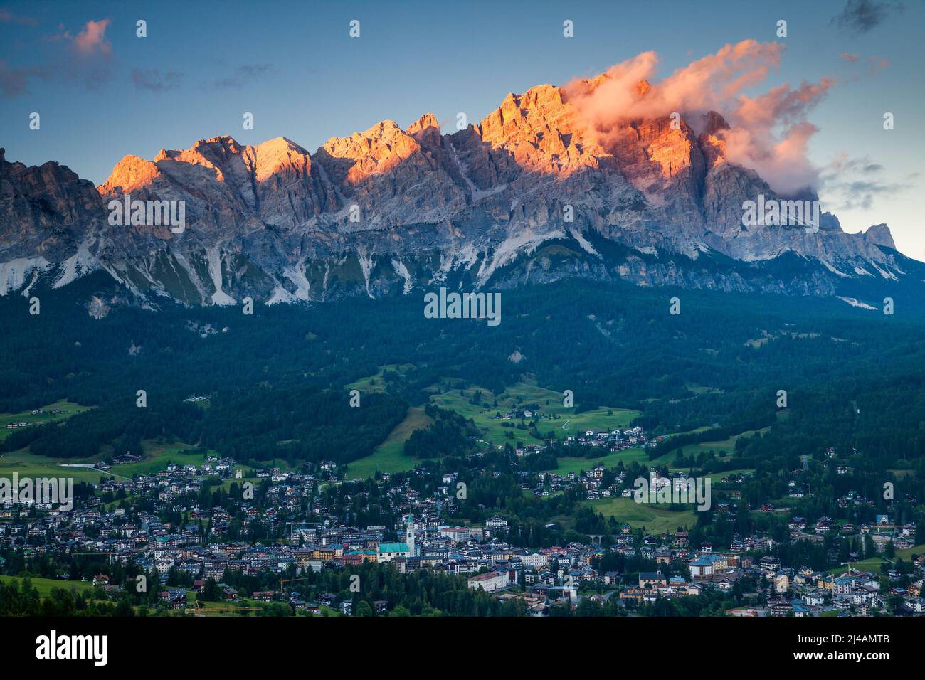 Colorful sunset over the town of Cortina d'Ampezzo, Dolomites, Italy ...