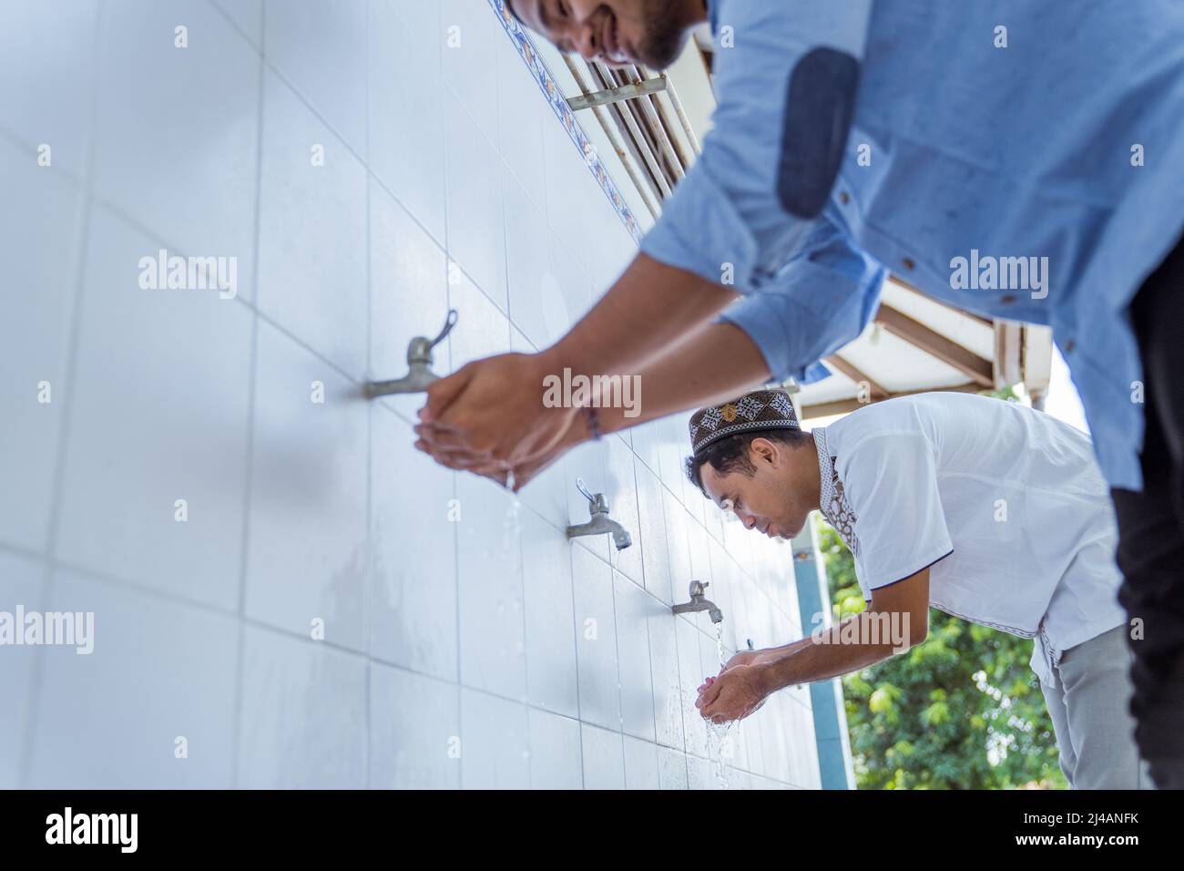 Man muslim perform ablution or wudu at the mosque Stock Photo - Alamy