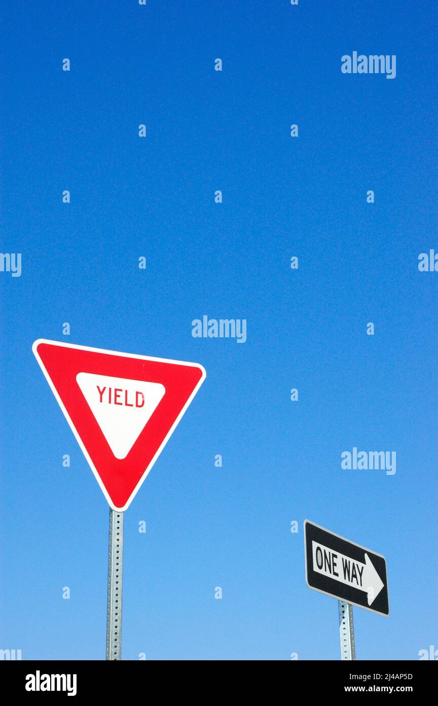 Yield and one way signs on freeway highway for drivers to see at ...