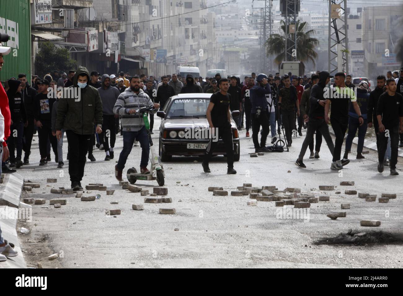 Nablus, Palestine. 13th Apr, 2022. Palestinians throw stones at Israeli ...