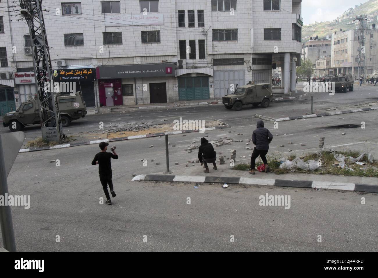 Nablus, Palestine. 13th Apr, 2022. Palestinians throw stones at Israeli ...