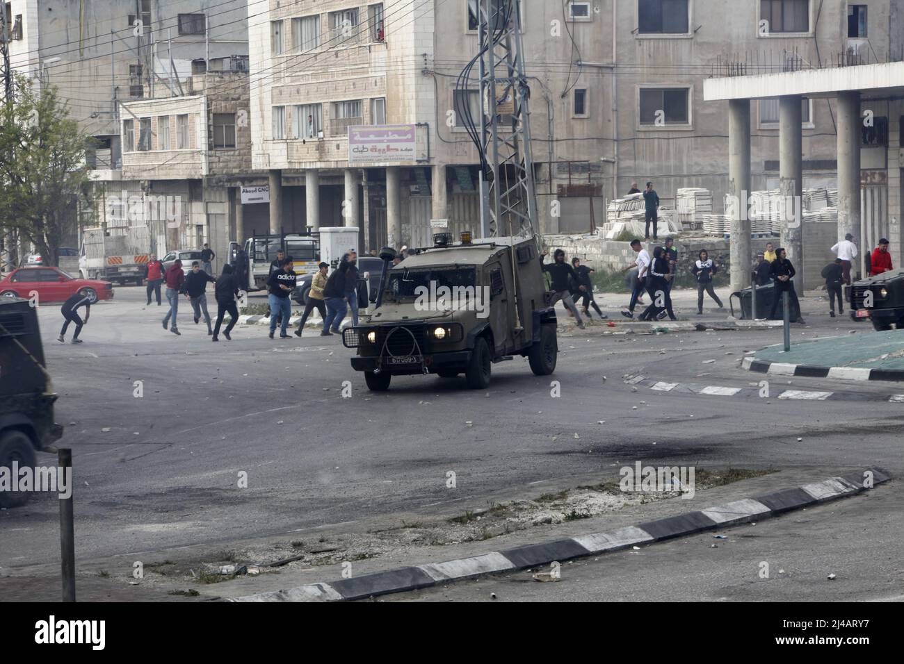 Nablus, Palestine. 13th Apr, 2022. Palestinians throw stones at Israeli ...