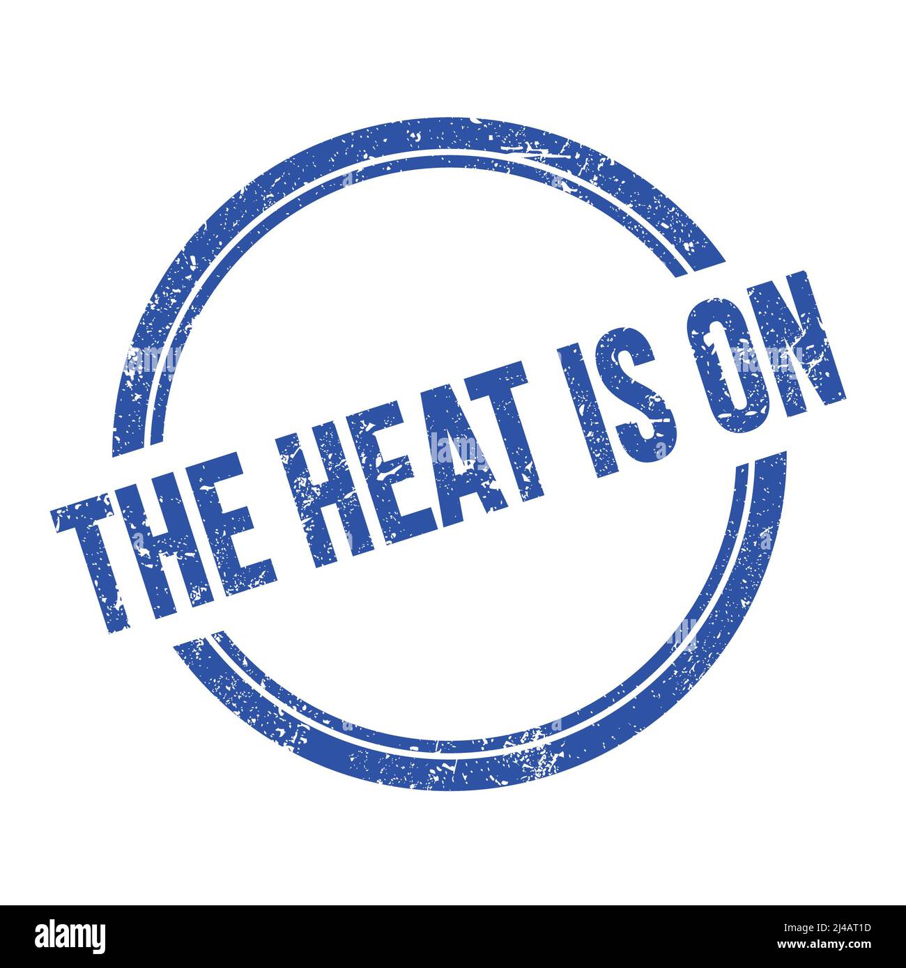 THE HEAT IS ON text written on blue grungy vintage round stamp Stock ...