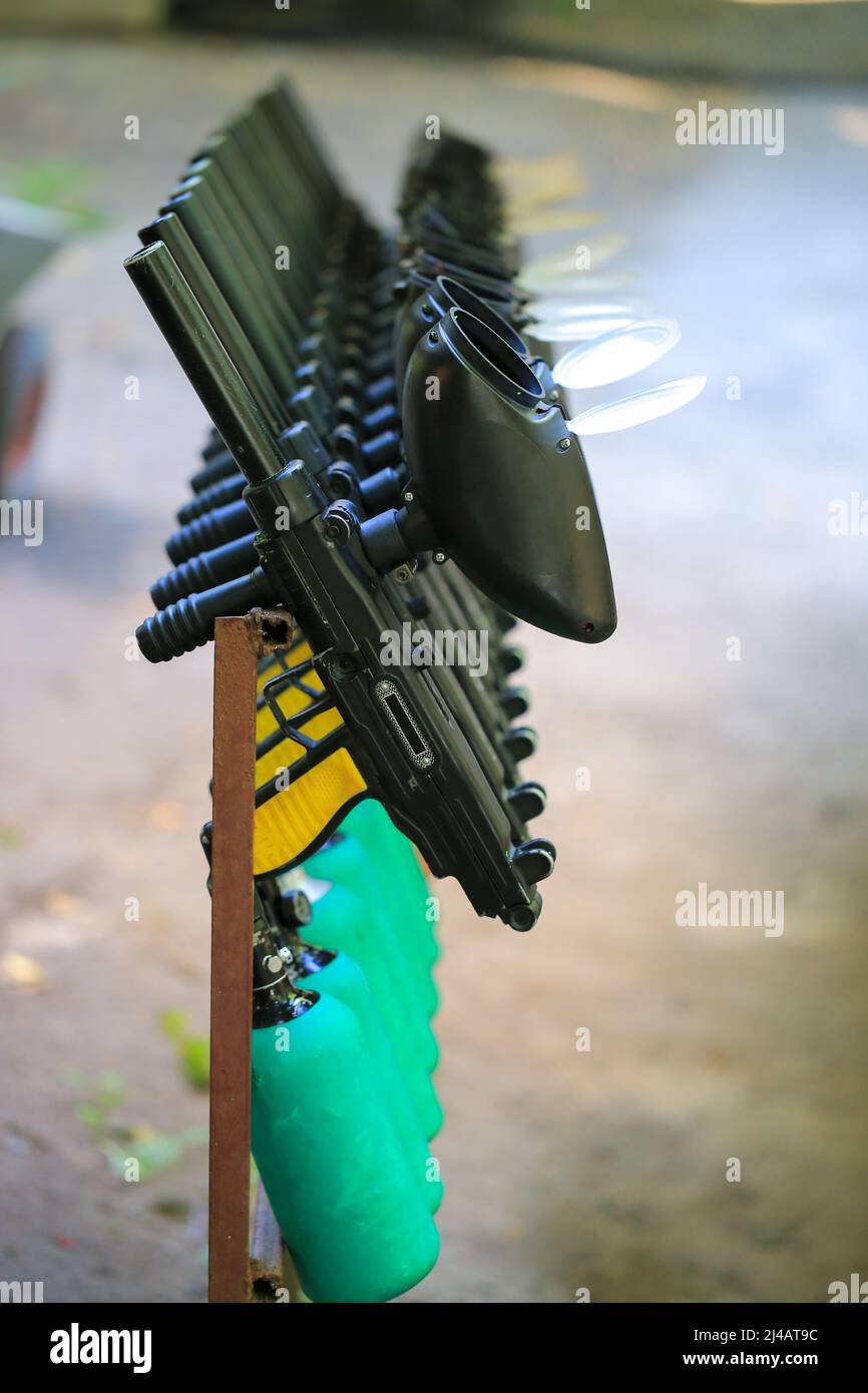 Paintball weapon on the stand Stock Photo - Alamy
