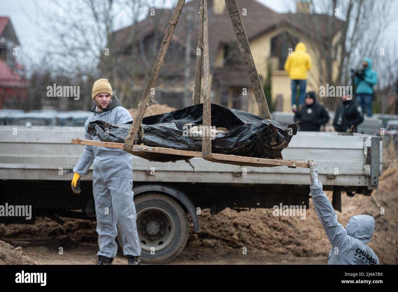 Bucha, Kyiv, Ukraine - April 13, 2022: people exhume from a mass grave ...