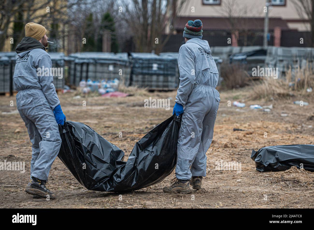 Bucha, Kyiv, Ukraine - April 13, 2022: people exhume from a mass grave ...
