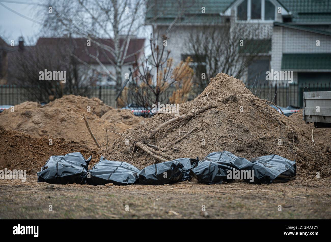 Bucha, Kyiv, Ukraine - April 13, 2022: people exhume from a mass grave ...