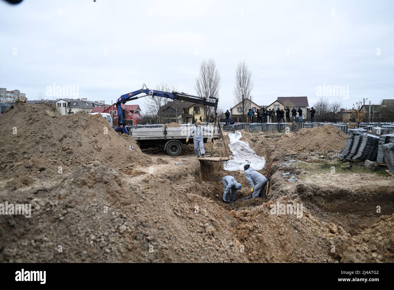 Bucha, Kyiv, Ukraine - April 13, 2022: people exhume from a mass grave ...
