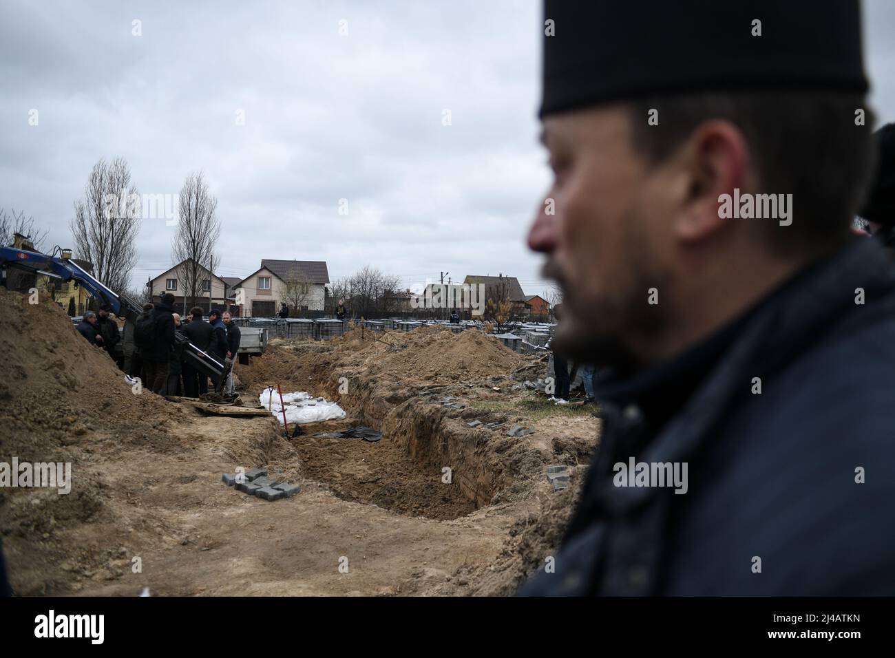 Bucha, Kyiv, Ukraine - April 13, 2022: people exhume from a mass grave ...