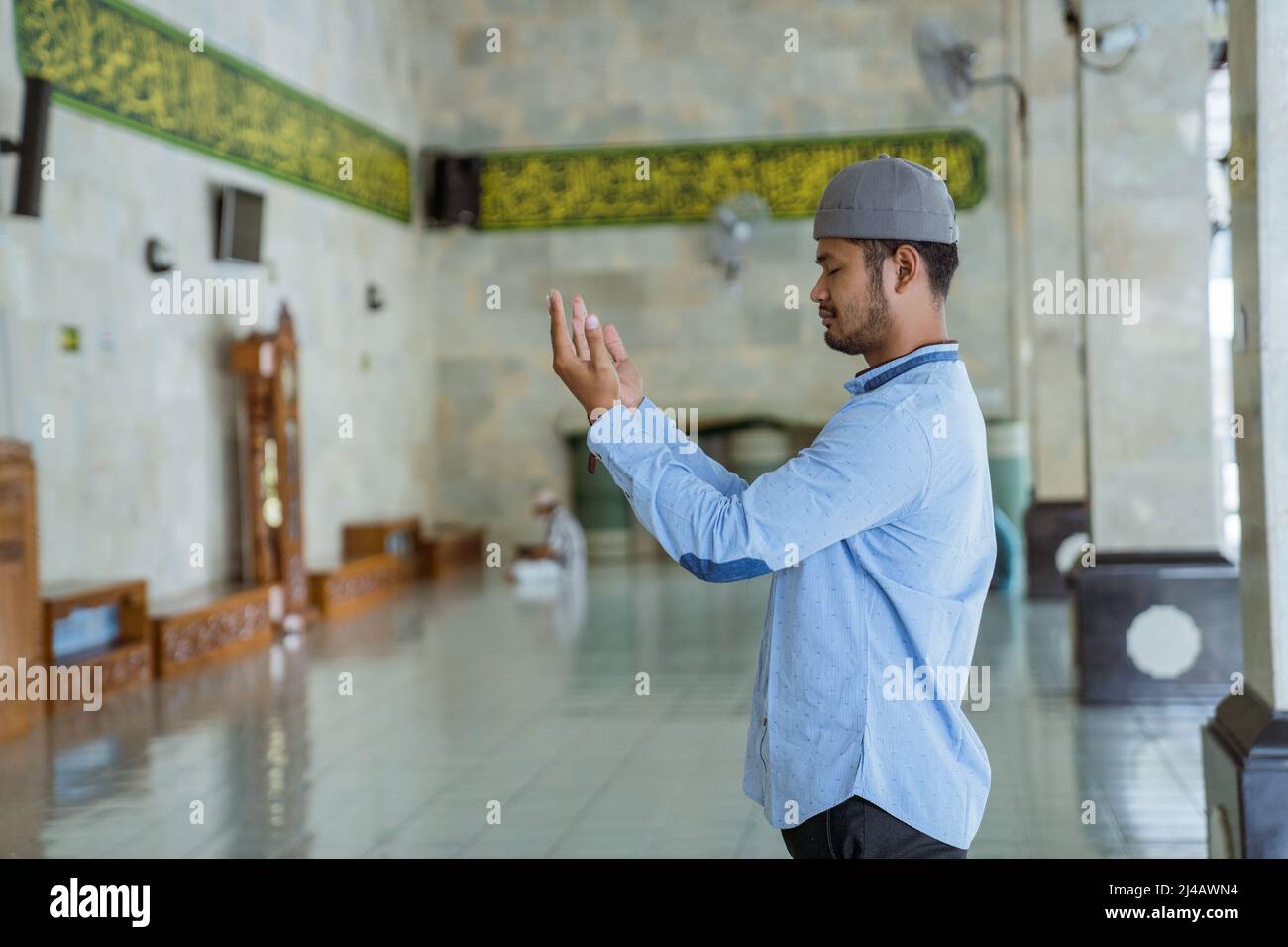 Man muslim doing prayer in the mosque Stock Photo - Alamy