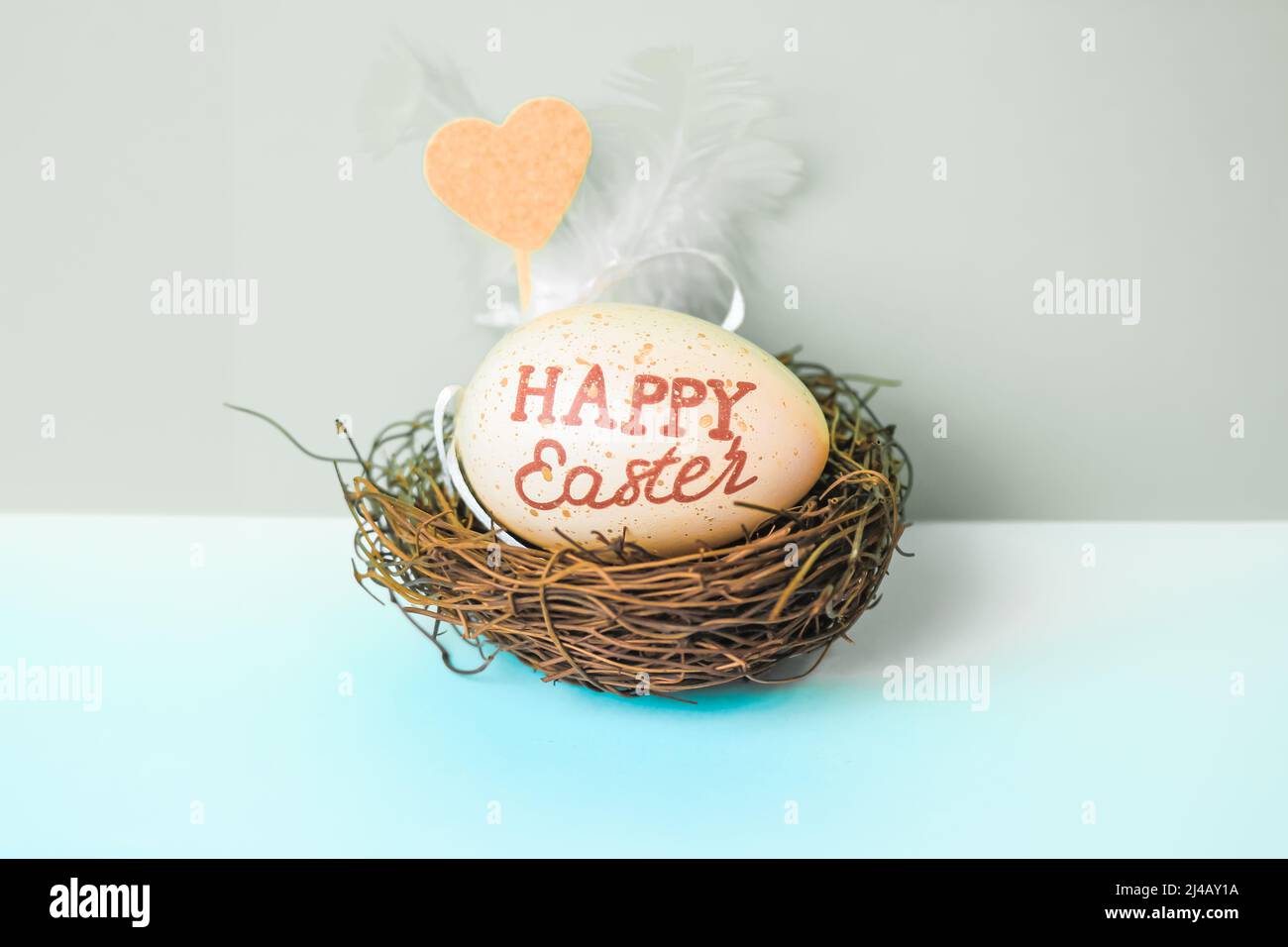Beige brown natural chicken egg with white feather and text Happy ...