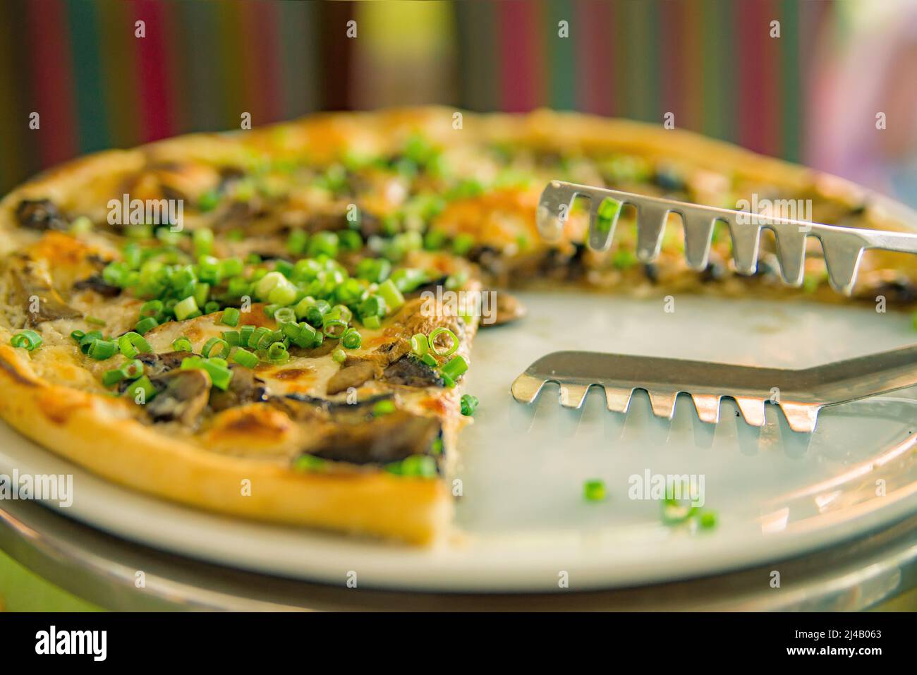 taking slices of pizza. Table with pizza in a restaurant. Pizza and ...
