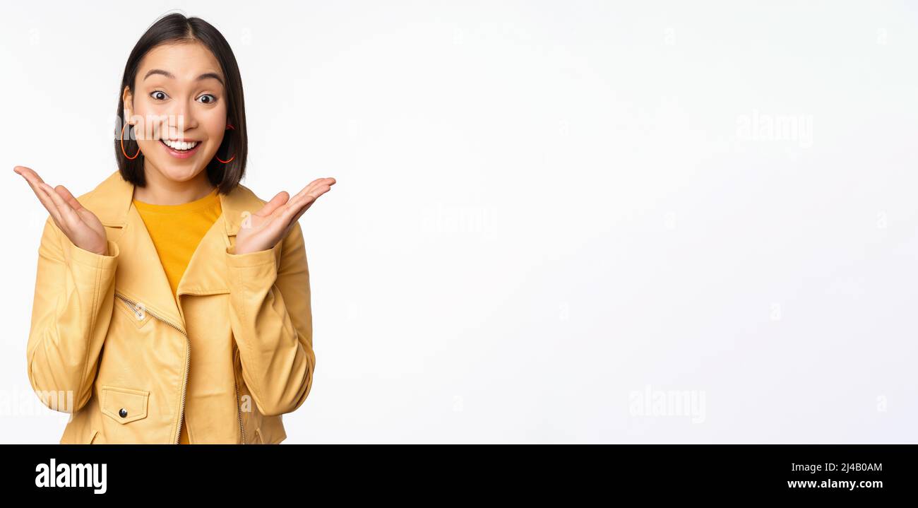 Image of asian woman looking surprised, amazed reaction, shocked face ...