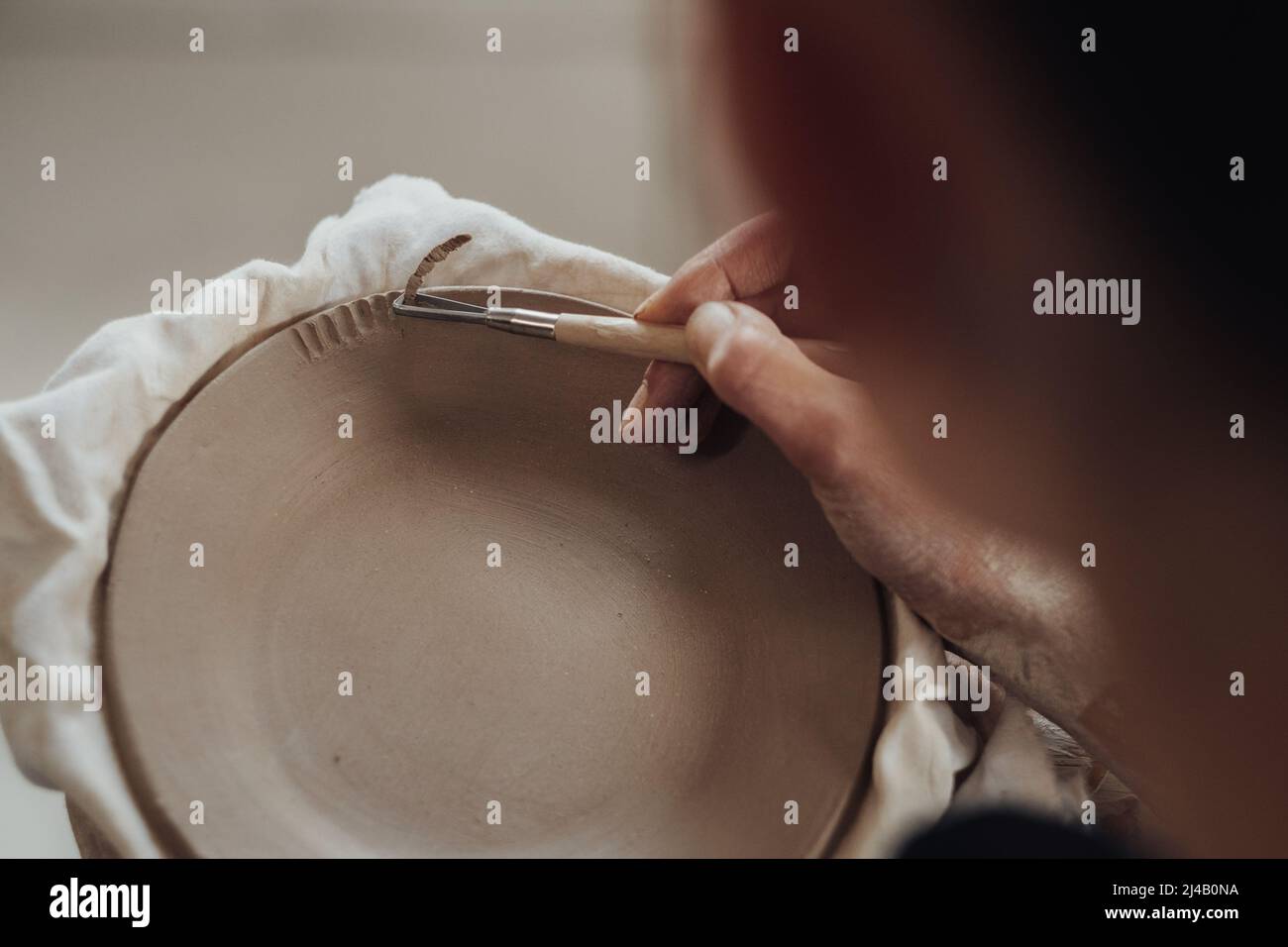 Close Up of Female Pottery Artist at Work, Woman Creating Patterns on a ...
