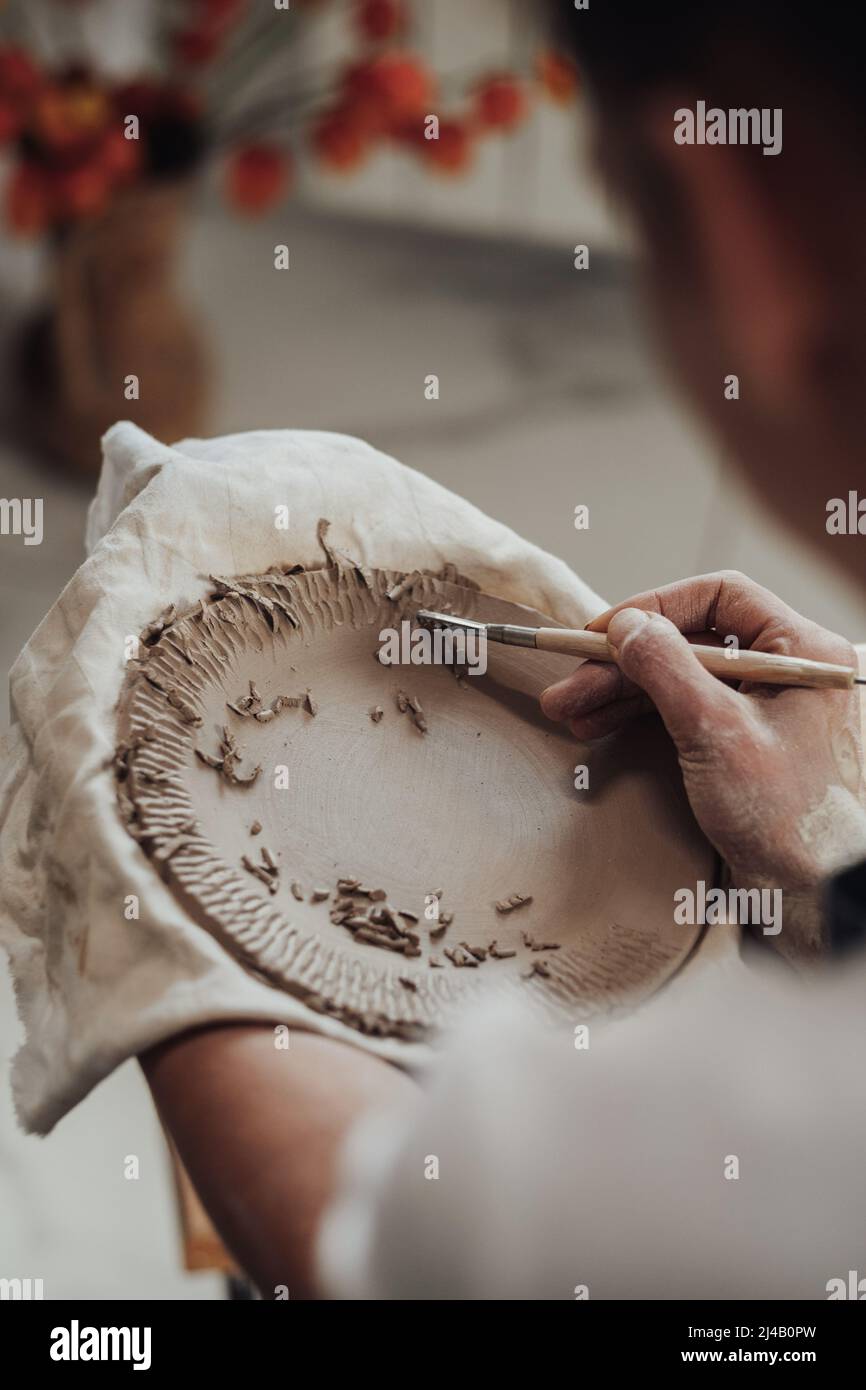Close Up of Female Pottery Artist at Work, Woman Creating Patterns on a ...