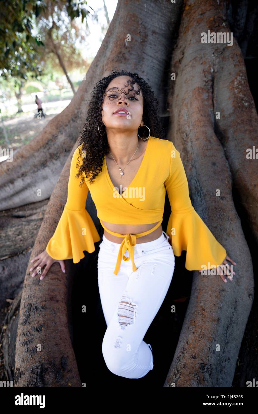 Portrait of a Beautiful Young Black Woman Surrounded By Enormous Rubber ...