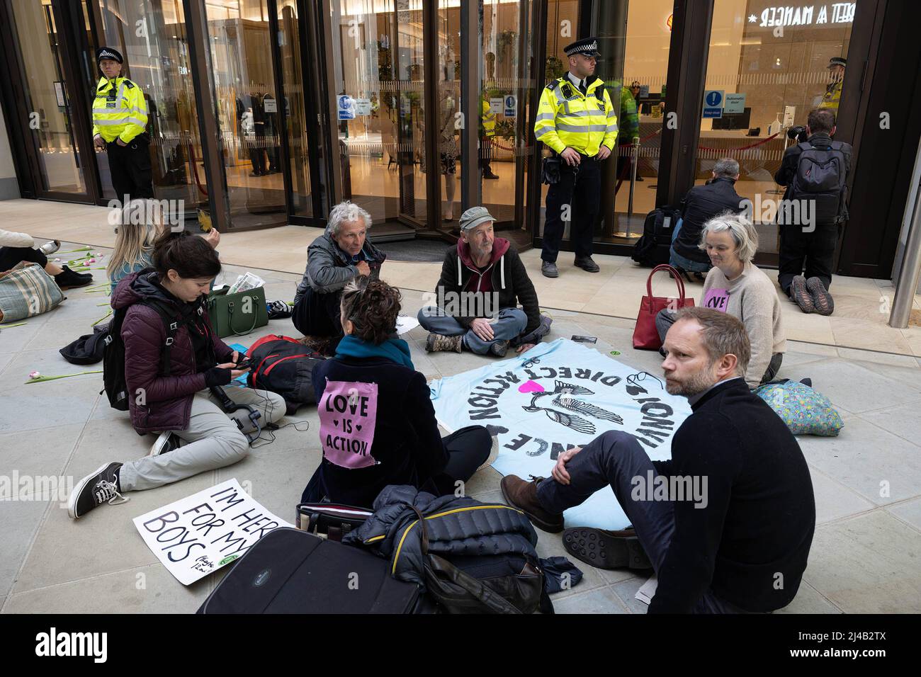 London, UK. 13th Apr, 2022. A group of protesters with their hands ...