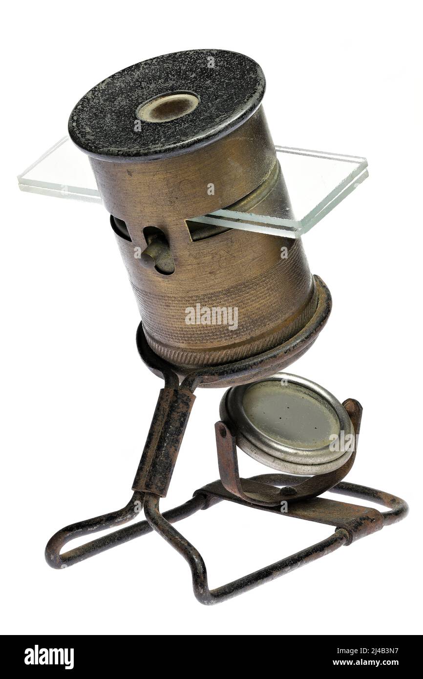 vintage pocket microscope isolated on white background Stock Photo - Alamy
