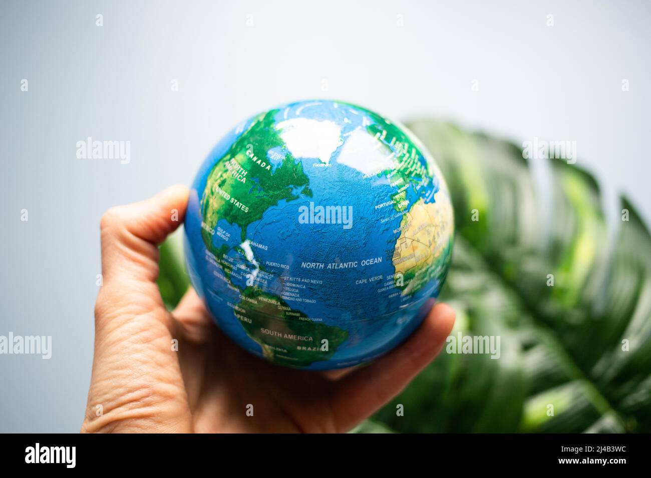 hand holding globe environment esg concept Stock Photo - Alamy