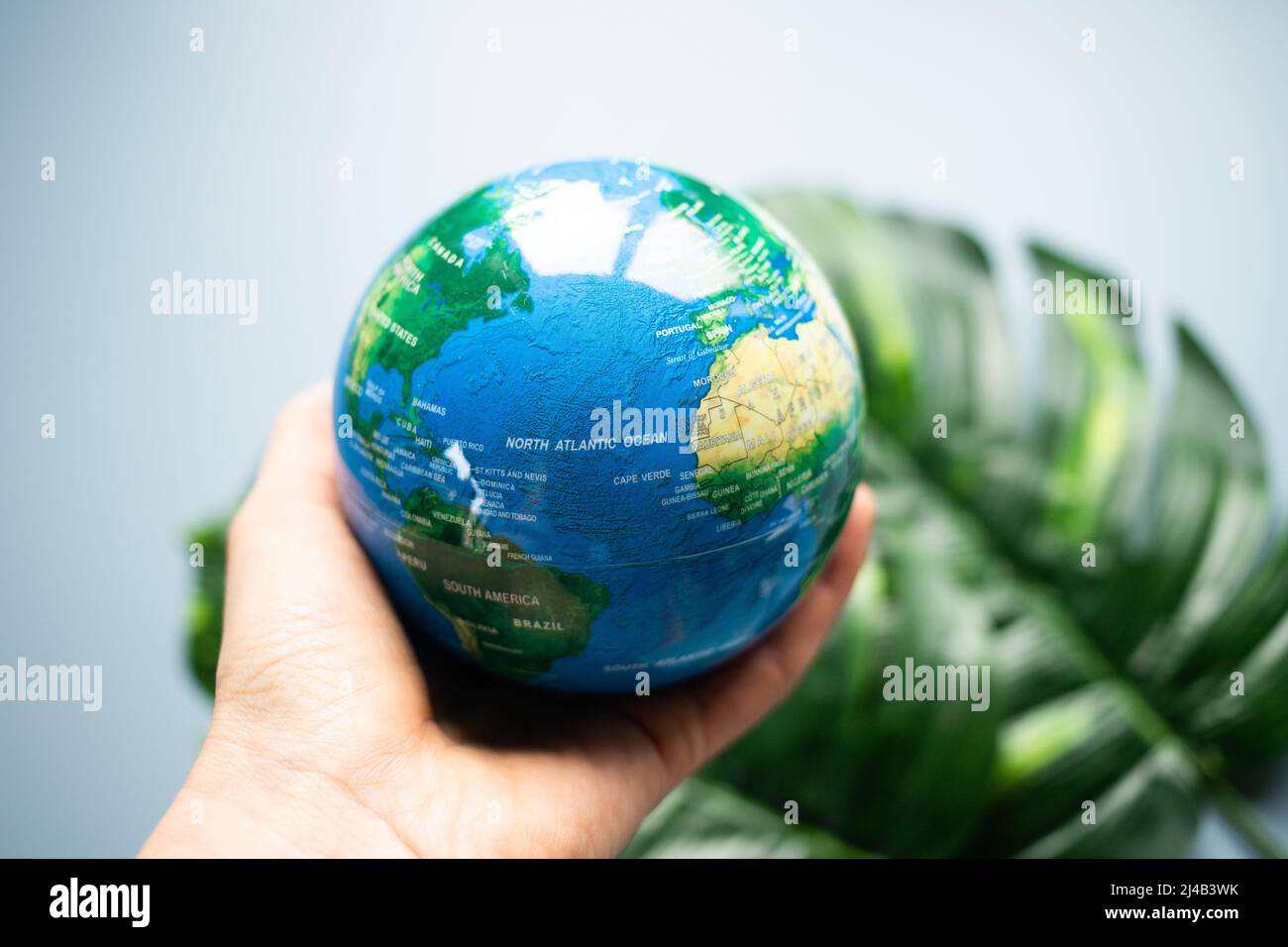 hand holding globe environment esg concept Stock Photo - Alamy