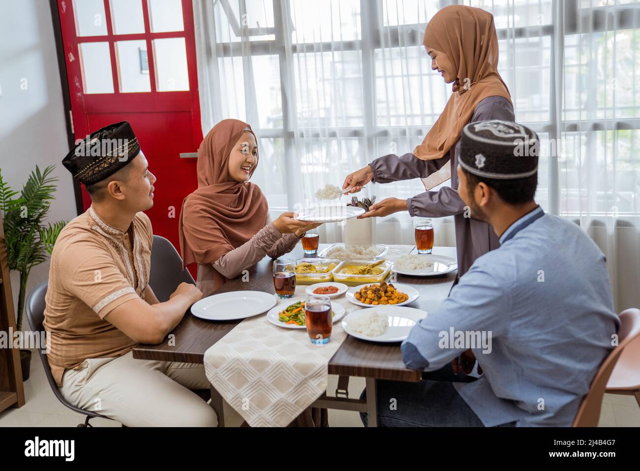 asian muslim friend and family break fasting together Stock Photo - Alamy