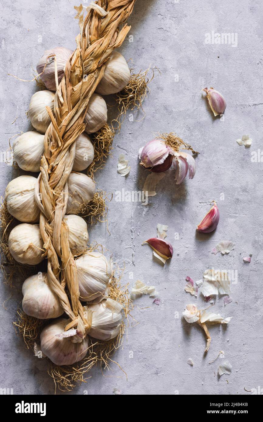 Italian garlic plait against a light background Stock Photo - Alamy