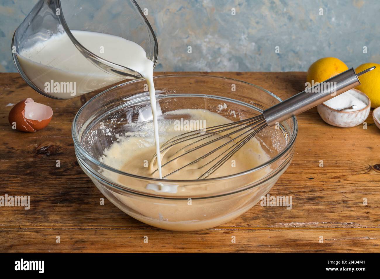 Mixing pancake batter in a bowl Stock Photo - Alamy