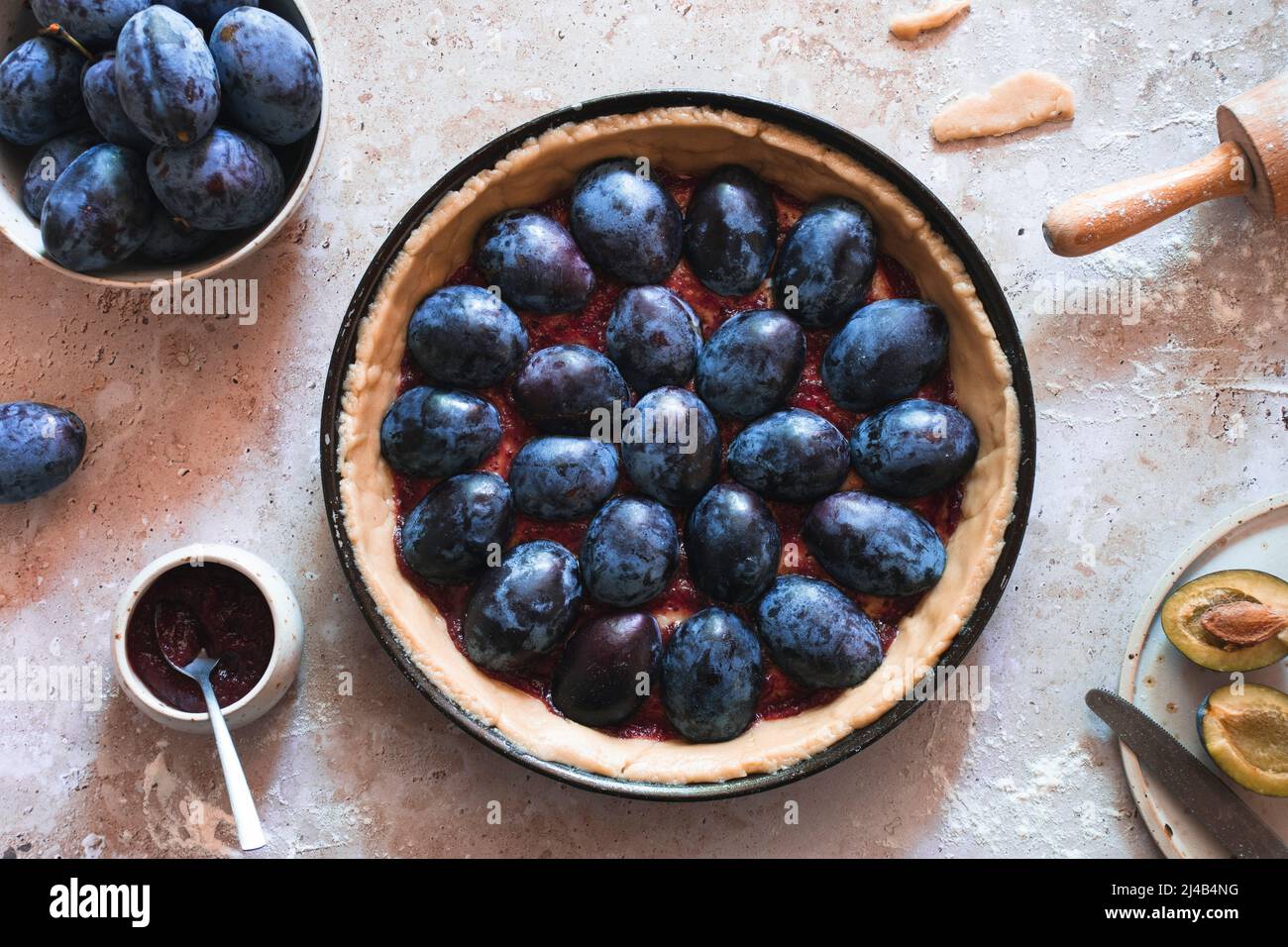 Plum pie in the making moody photo Stock Photo - Alamy