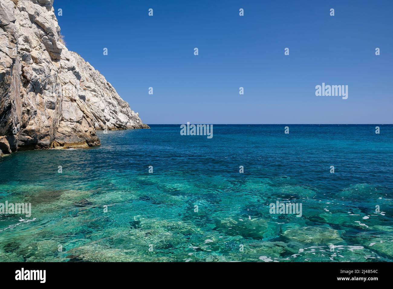 Amazing turquoise colored waters at the beach of Perissa in Santorini ...
