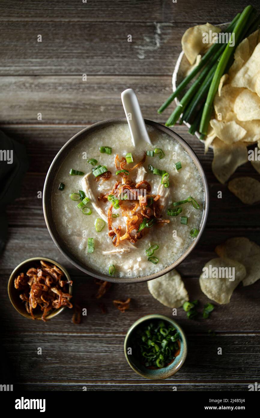Steamy bowl of Chicken Jook in a rustic kitchen Stock Photo - Alamy