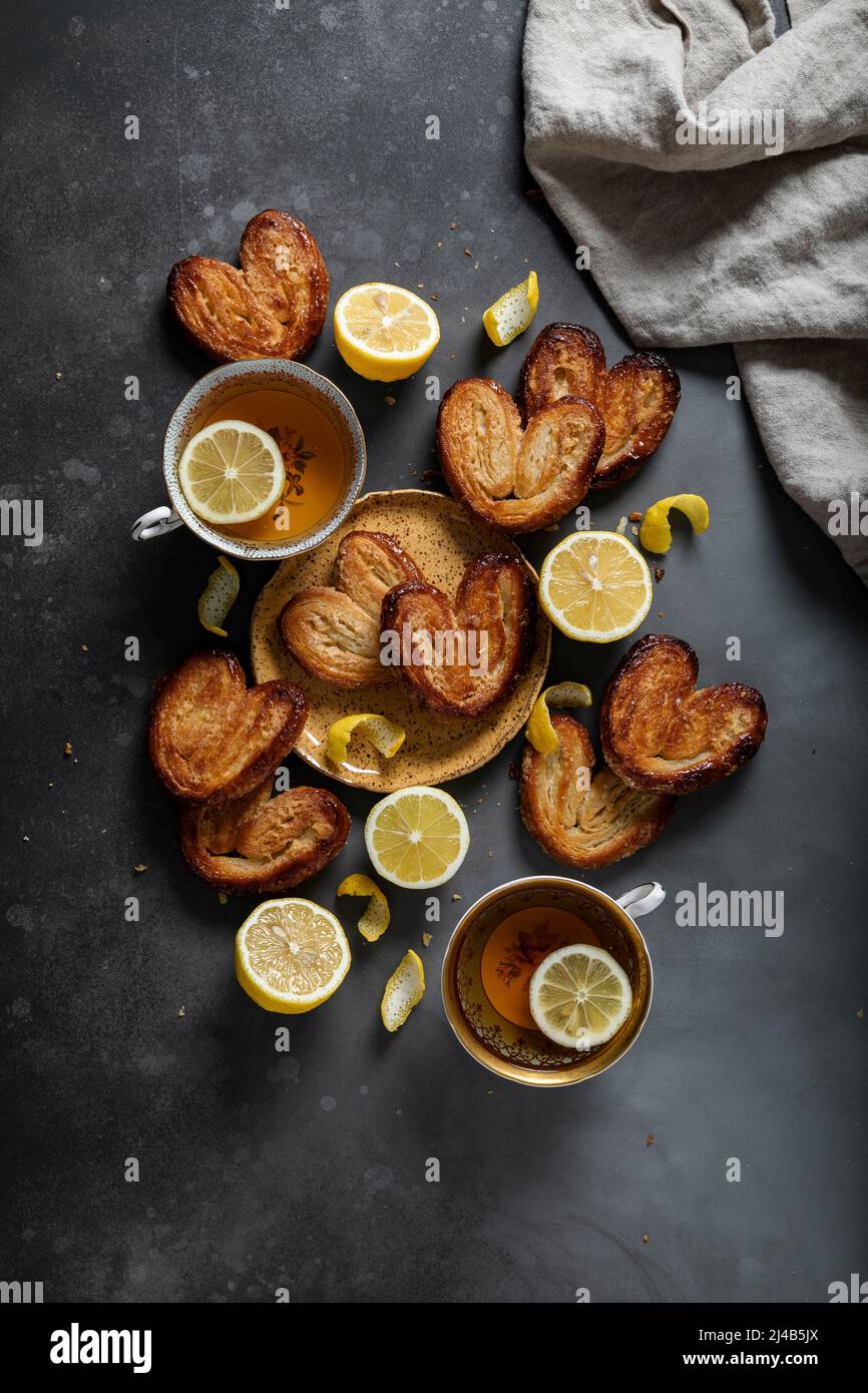 Lemon Palmiers, made from puff pastry on a dark background Stock Photo ...