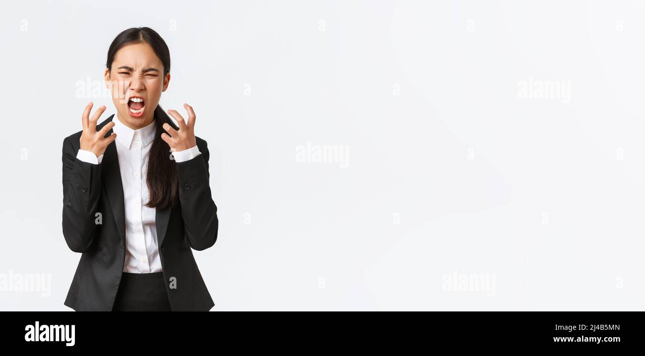 Mad disappointed CEO angry at employees. Outraged asian female manager ...