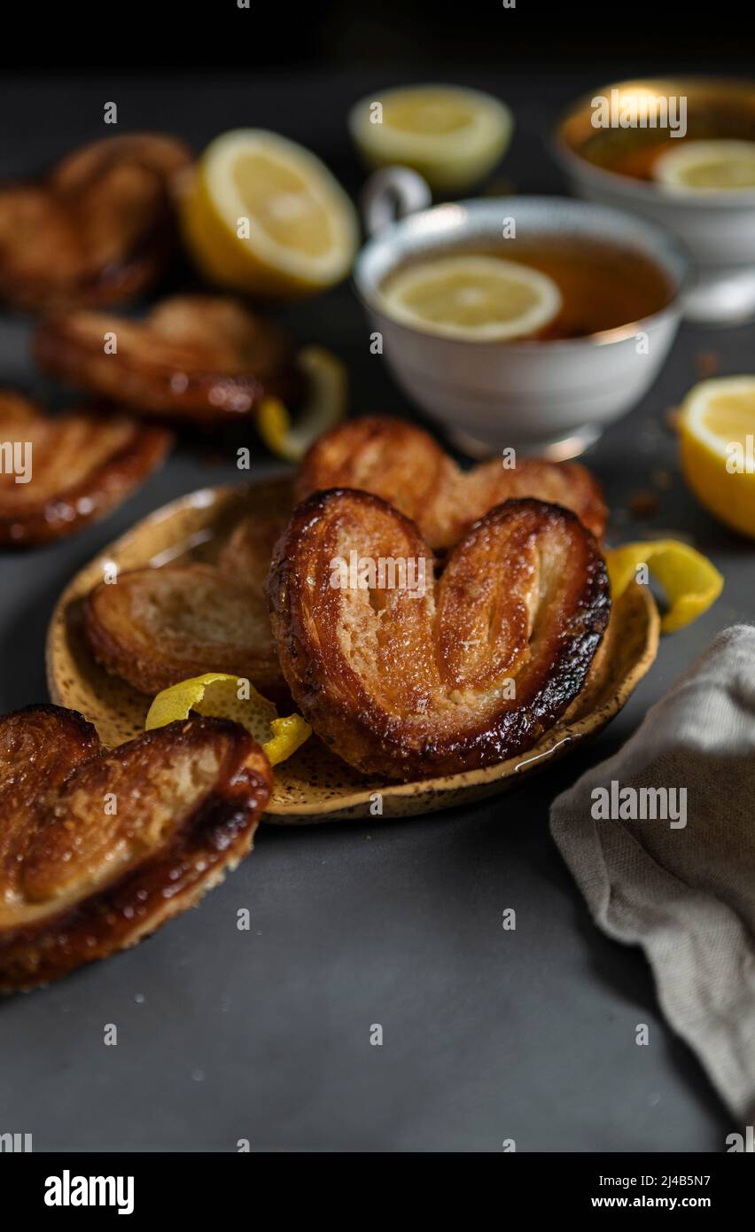 Lemon Palmiers, made from puff pastry on a dark background Stock Photo ...