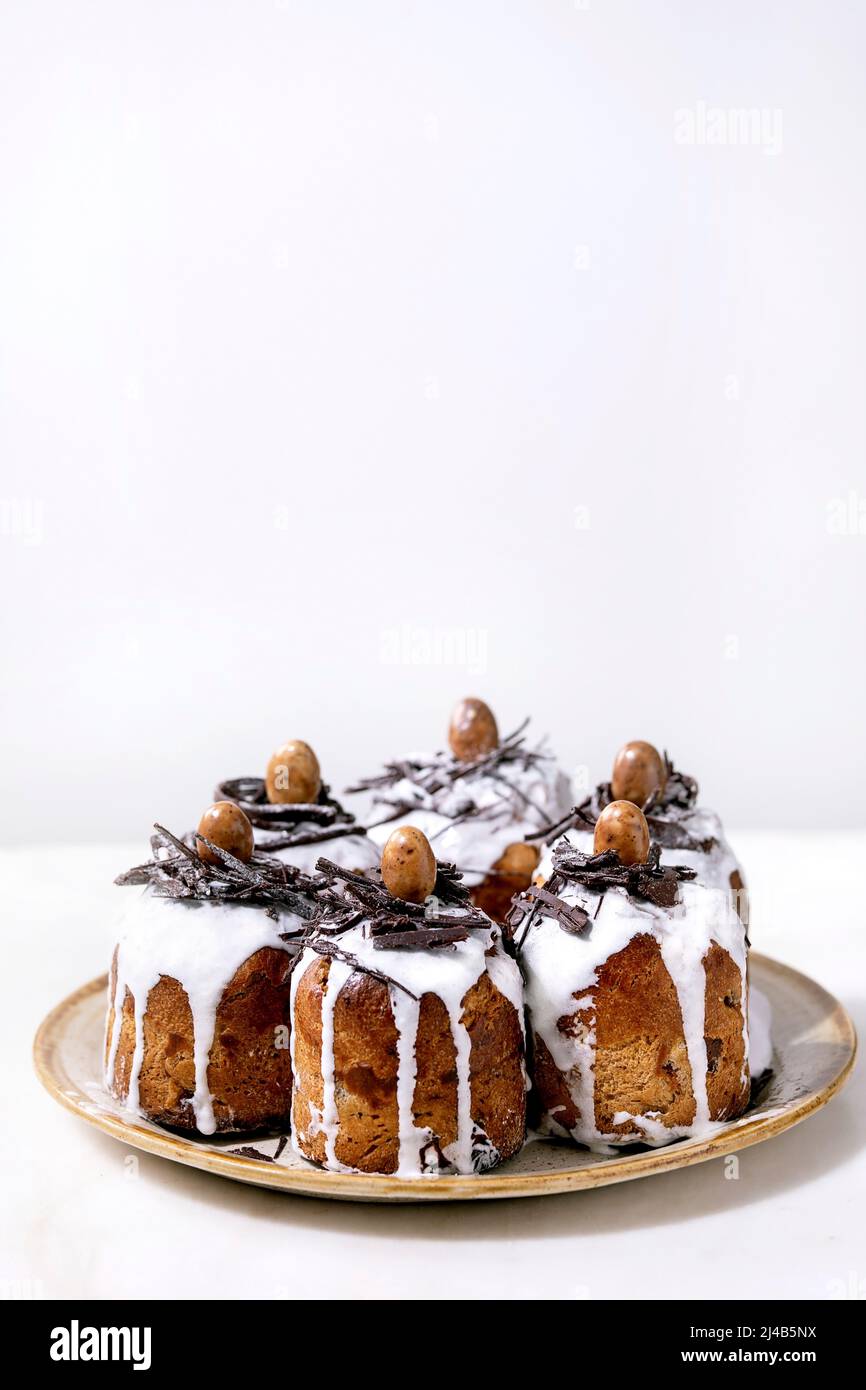 Homemade traditionla Easter kulich cake with chocolate nests and eggs ...