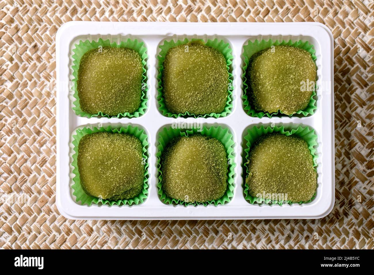 Asian rice dessert sweet green matcha mochi in retail plastic packaging ...
