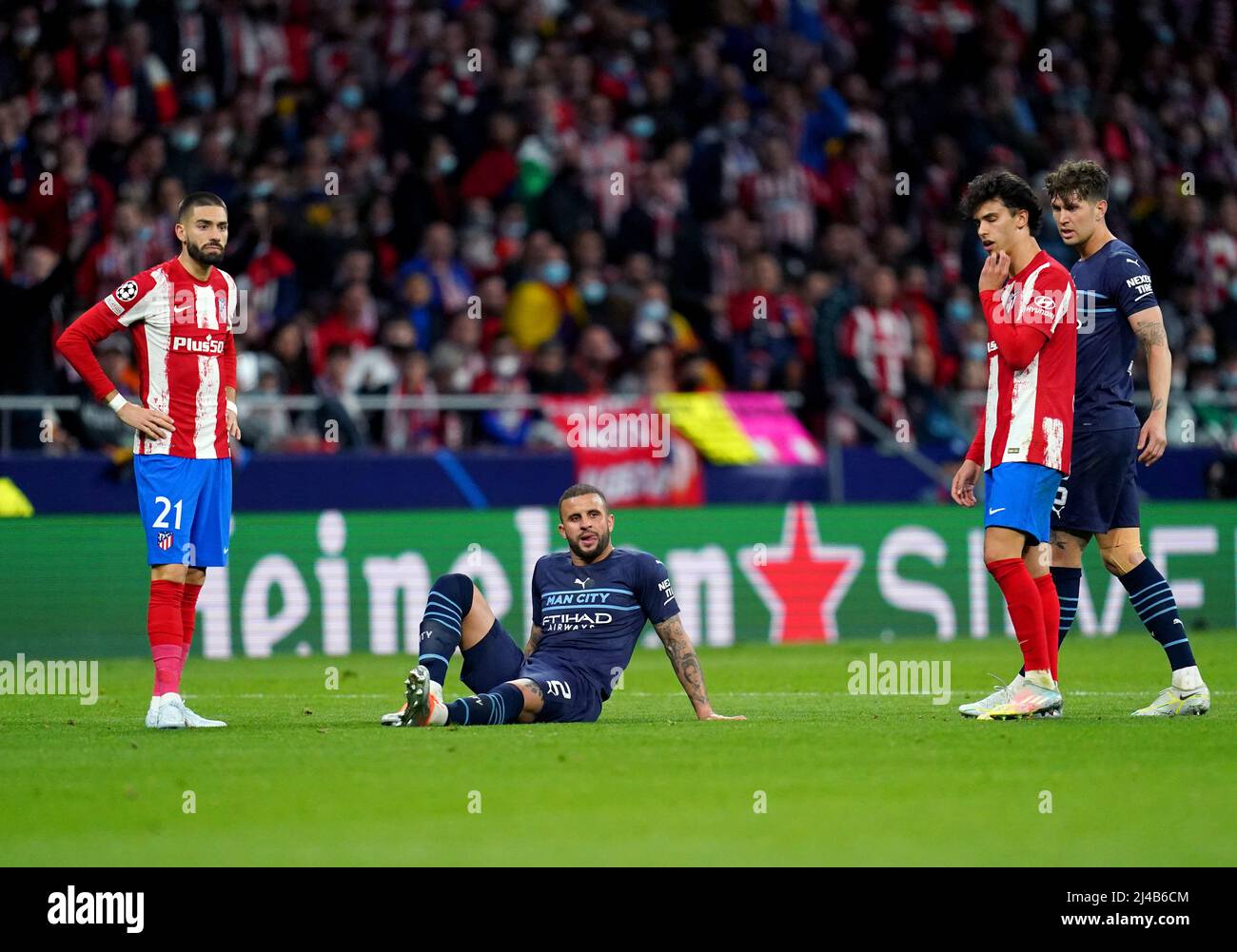 Manchester City's Kyle Walker (centre) goes down injured during the ...