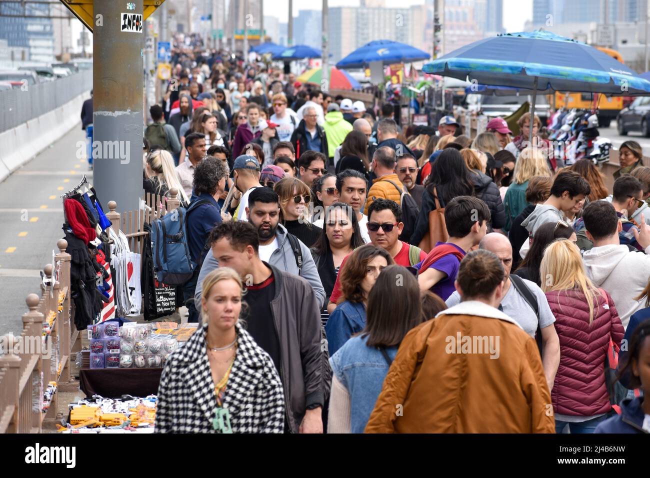 Tourists are coming back to New York City. A big crowd is seen walking ...