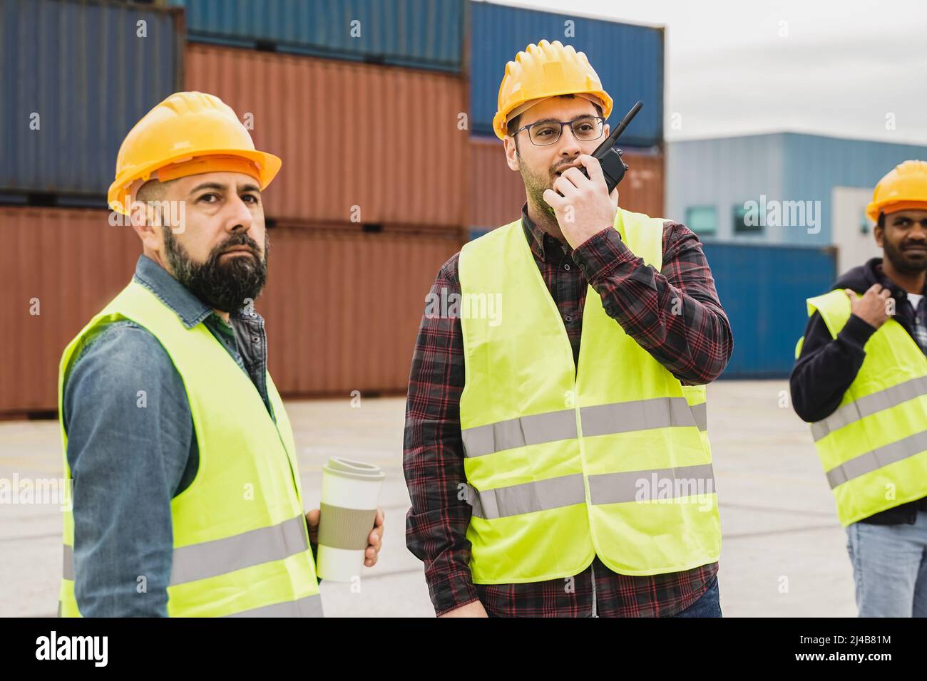 Engineer industrial people working at shipping containers port terminal ...