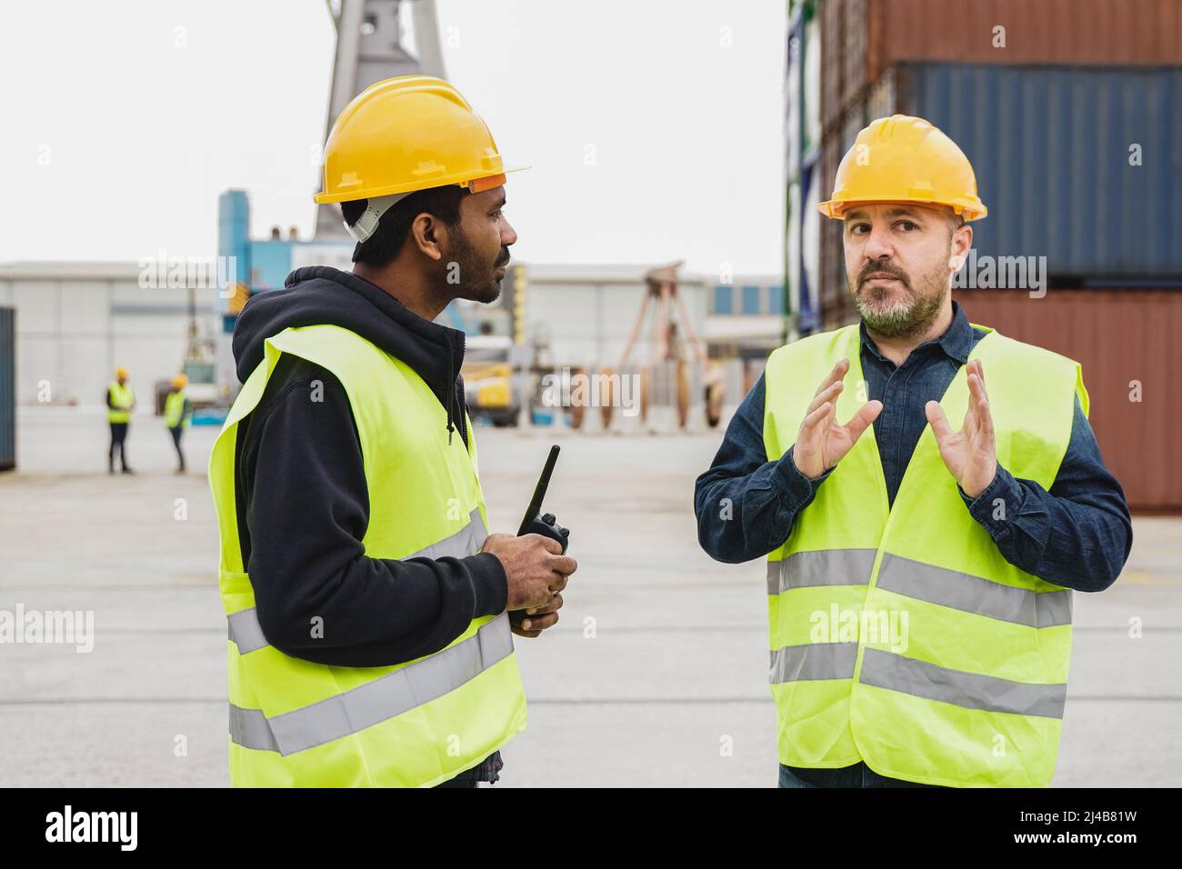 Multiracial industrial people working at shipping containers port ...