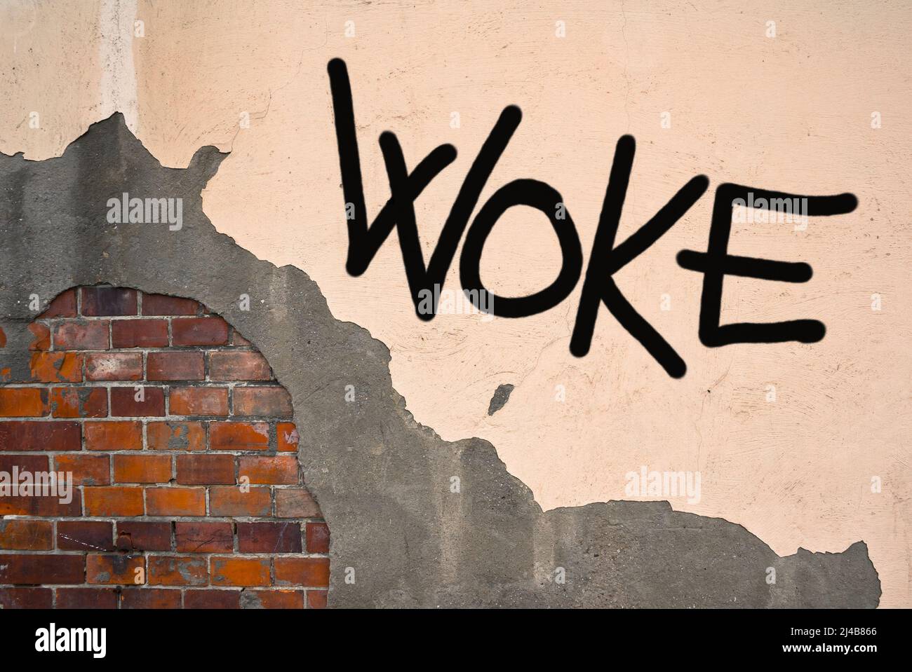 Handwritten graffiti Woke sprayed on the wall, anarchist aesthetics ...