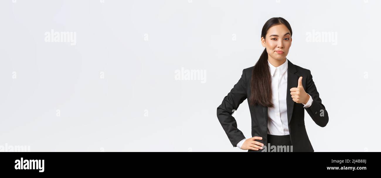 Pleased female entrepreneur, lady boss in black suit satisfied with ...