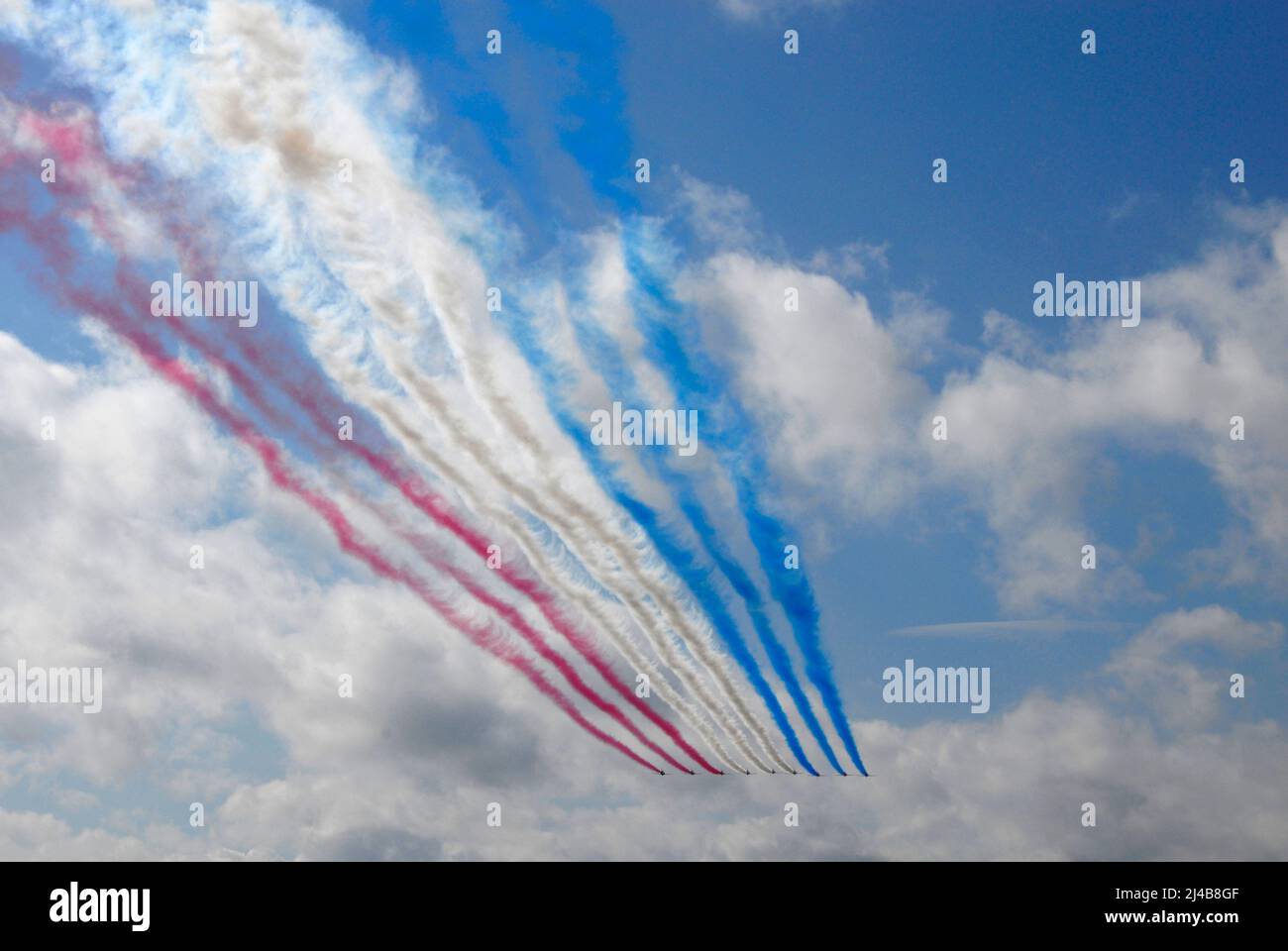The RAF Red Arrows aerobatic team flying into the distance leaving ...