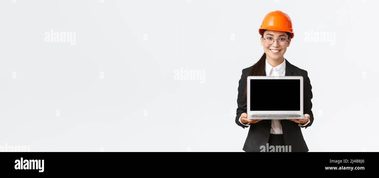 Smiling professional female asian engineer introduce construction plan ...