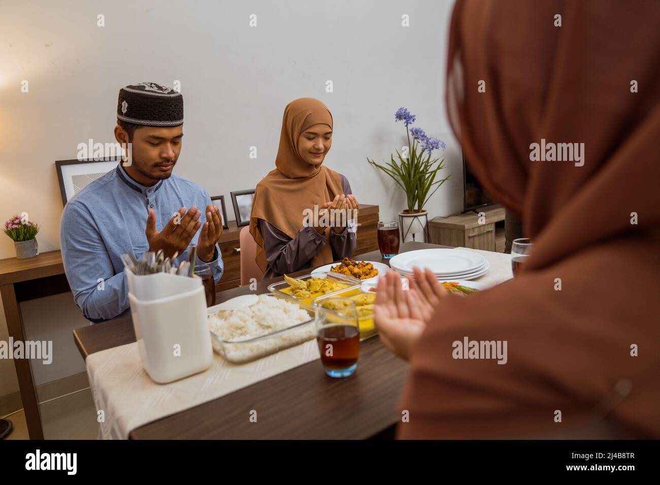 muslim people praying before break fasting iftar dinner together Stock ...