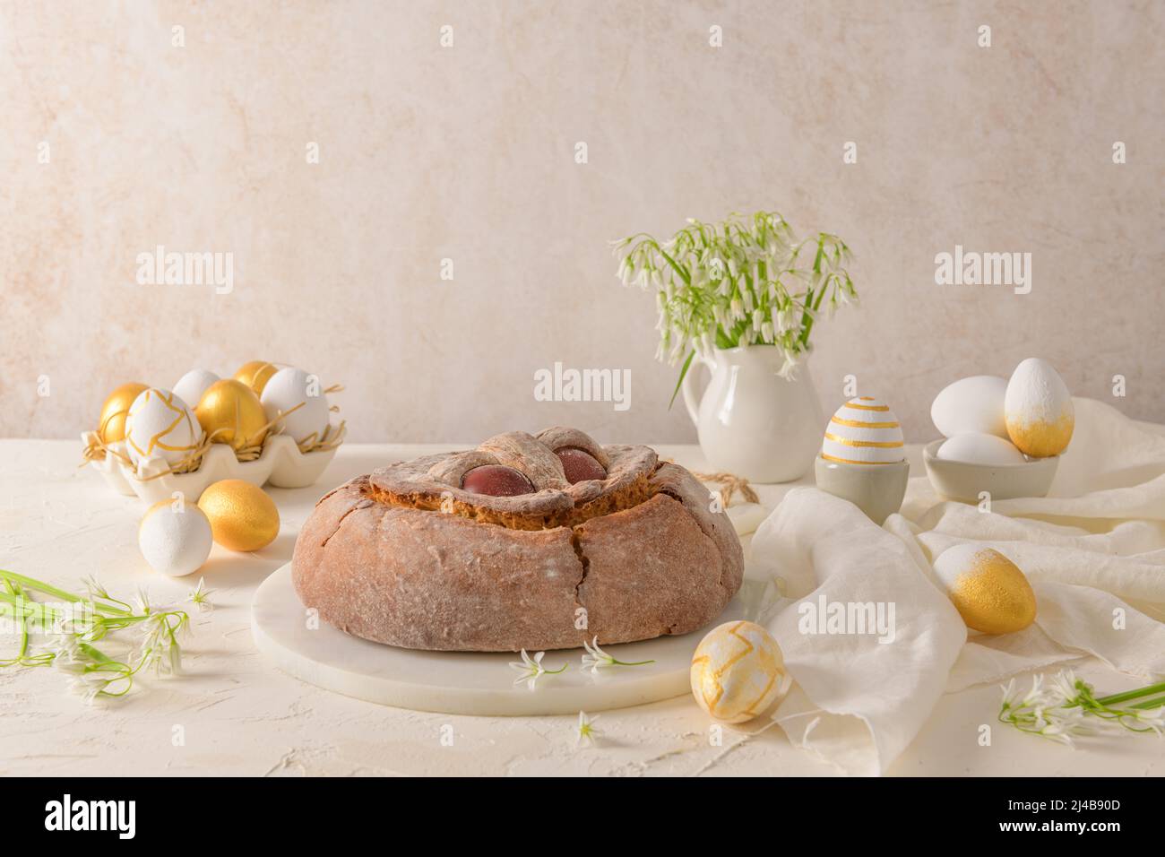 Portuguese traditional Easter cake. Folar with eggs on easter table ...