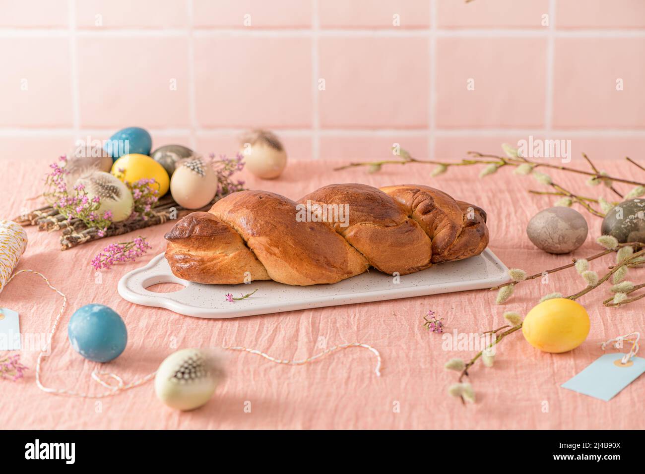 Portuguese traditional Easter cake. Folar with eggs on easter table ...