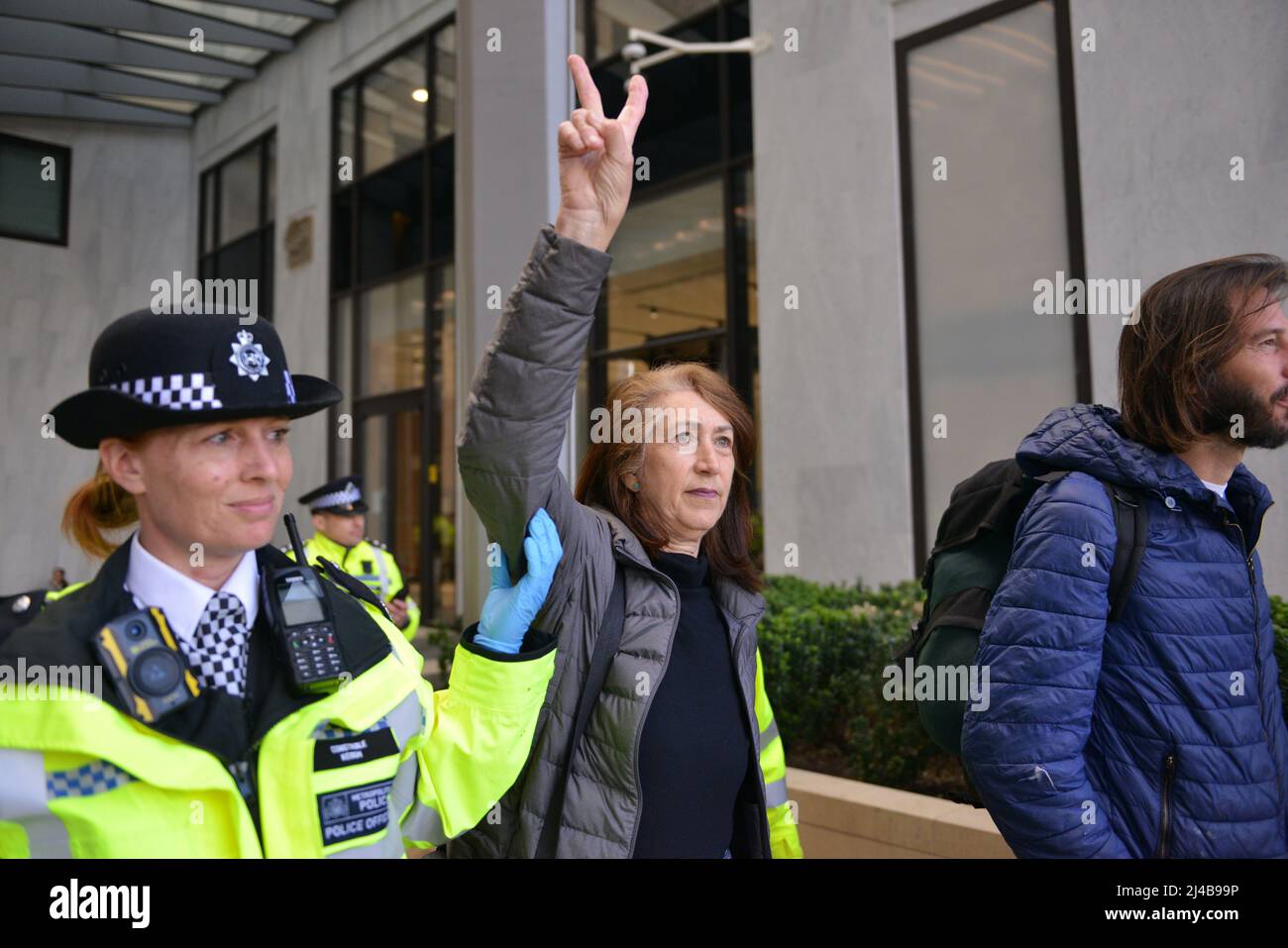 An activist gestures while being arrested for entering Shells HQ during ...