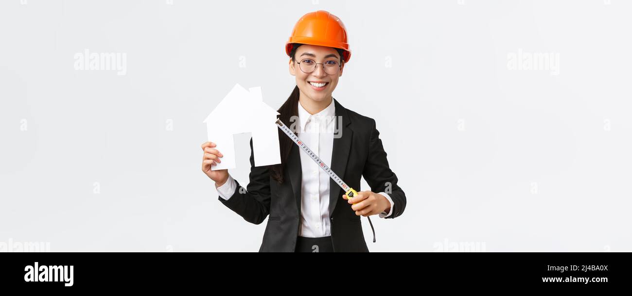 Smiling professional female asian engineer, architect in helmet and ...