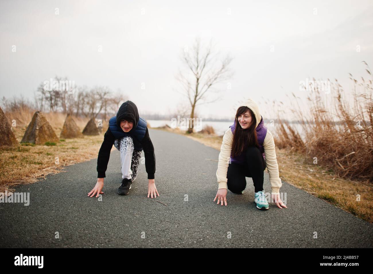 Mother with son getting ready for race Stock Photo - Alamy